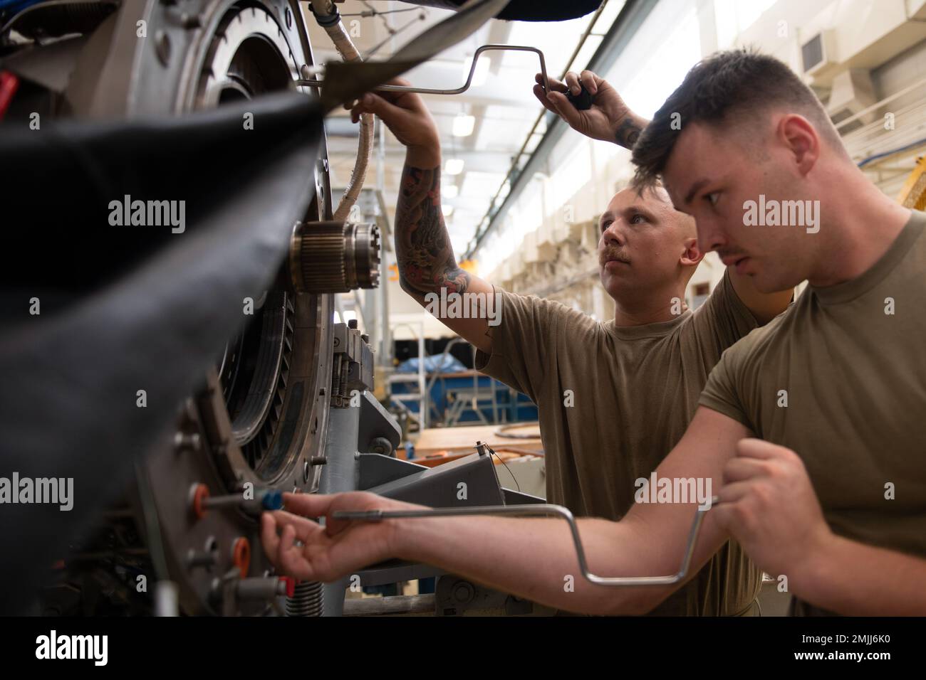 Senior Airman Matthew Wgeishofski, left, and Airman 1st Class Mark ...