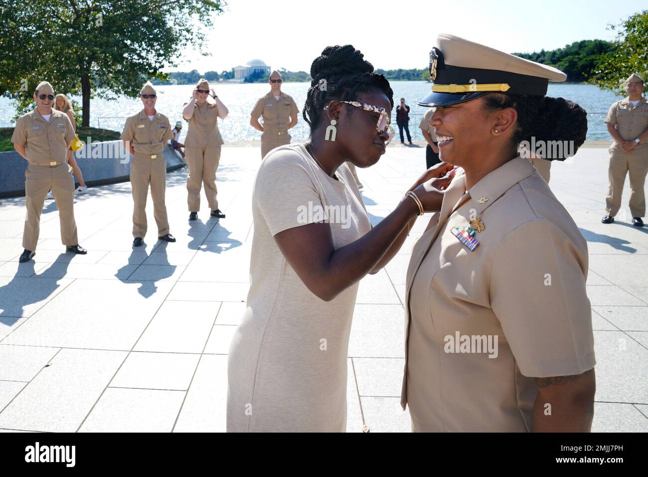 LCDR Brittni N. King's new rank is pinned by her wife, Ashleigh, during ...