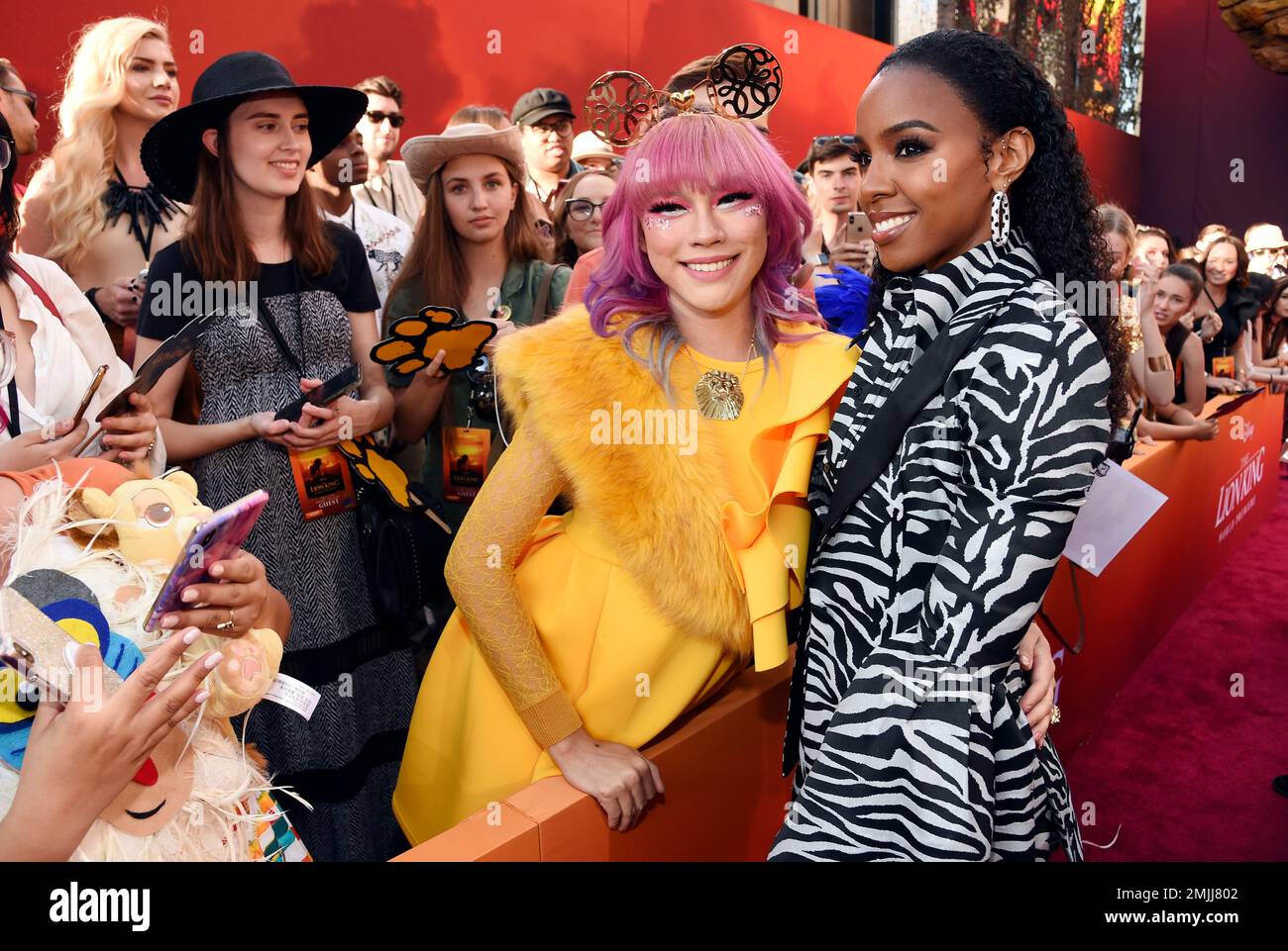 Singer Kelly Rowland, right, poses with crowd members at the premiere ...