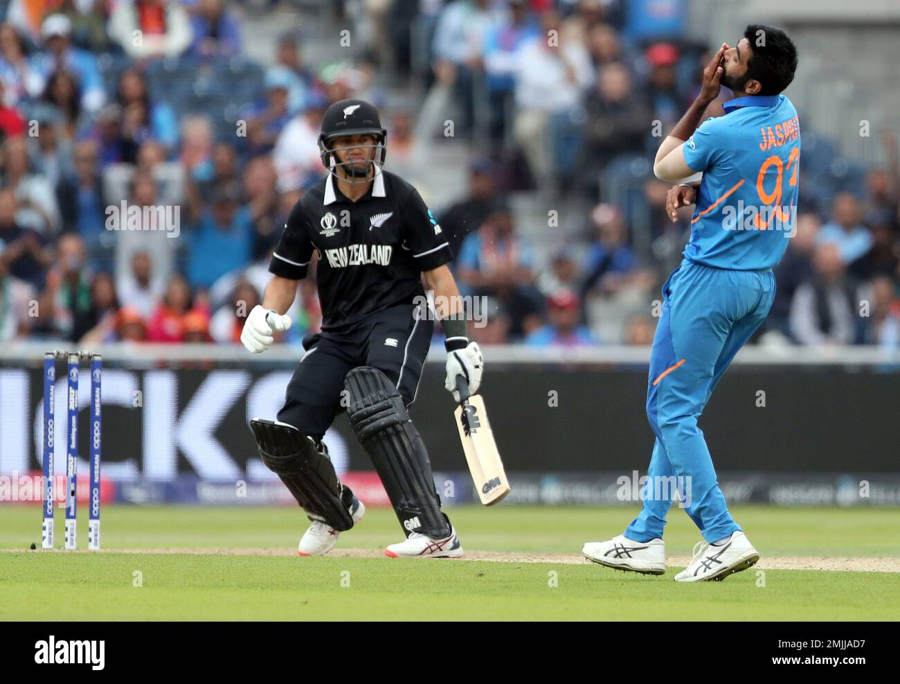 India's Jasprit Bumrah, right, reacts after a catch drop by ...