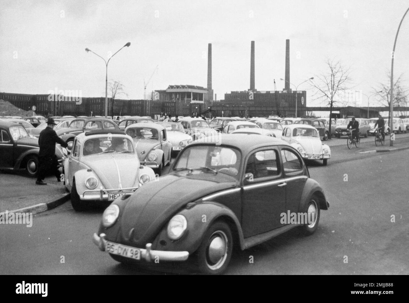 FILE - In this April 27, 1966 file photo, Volkswagen workers drive ...