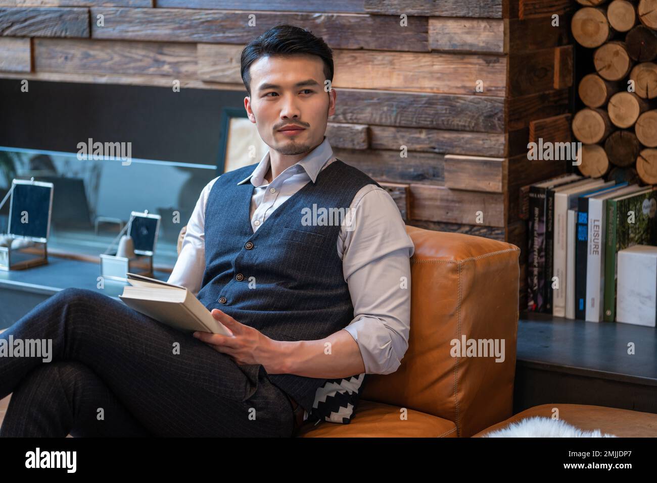 Business man reading a book Stock Photo - Alamy