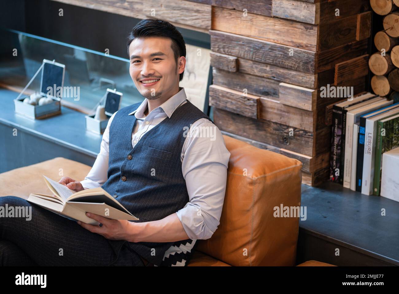 Business man reading a book Stock Photo - Alamy