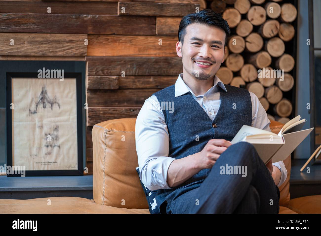 Business man reading a book Stock Photo - Alamy
