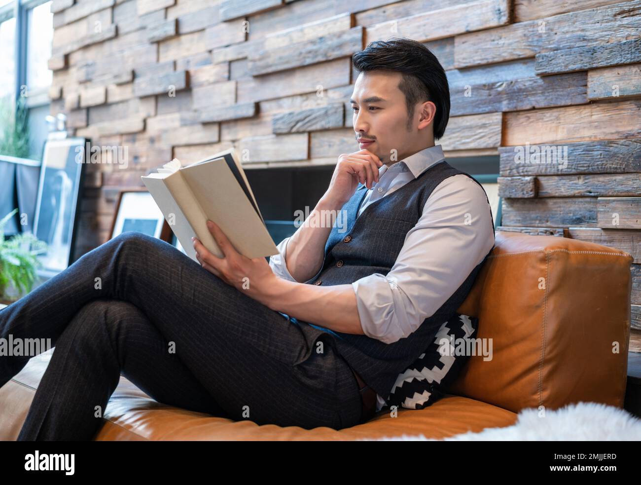Business man reading a book Stock Photo - Alamy