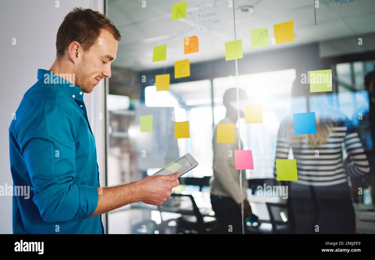 Supporting a problem solving session with smart technology. a young man ...