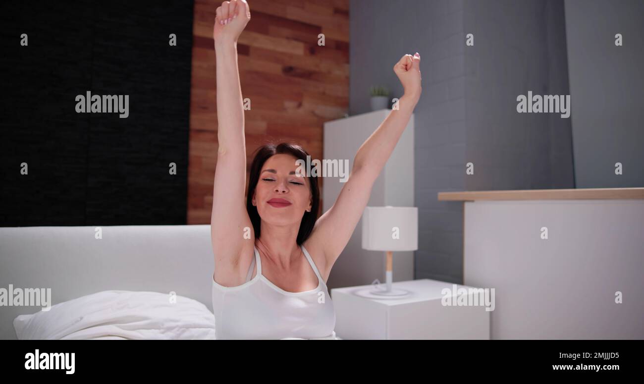 Woman Waking Up. Whole Body Wakeup And Stretching Stock Photo - Alamy
