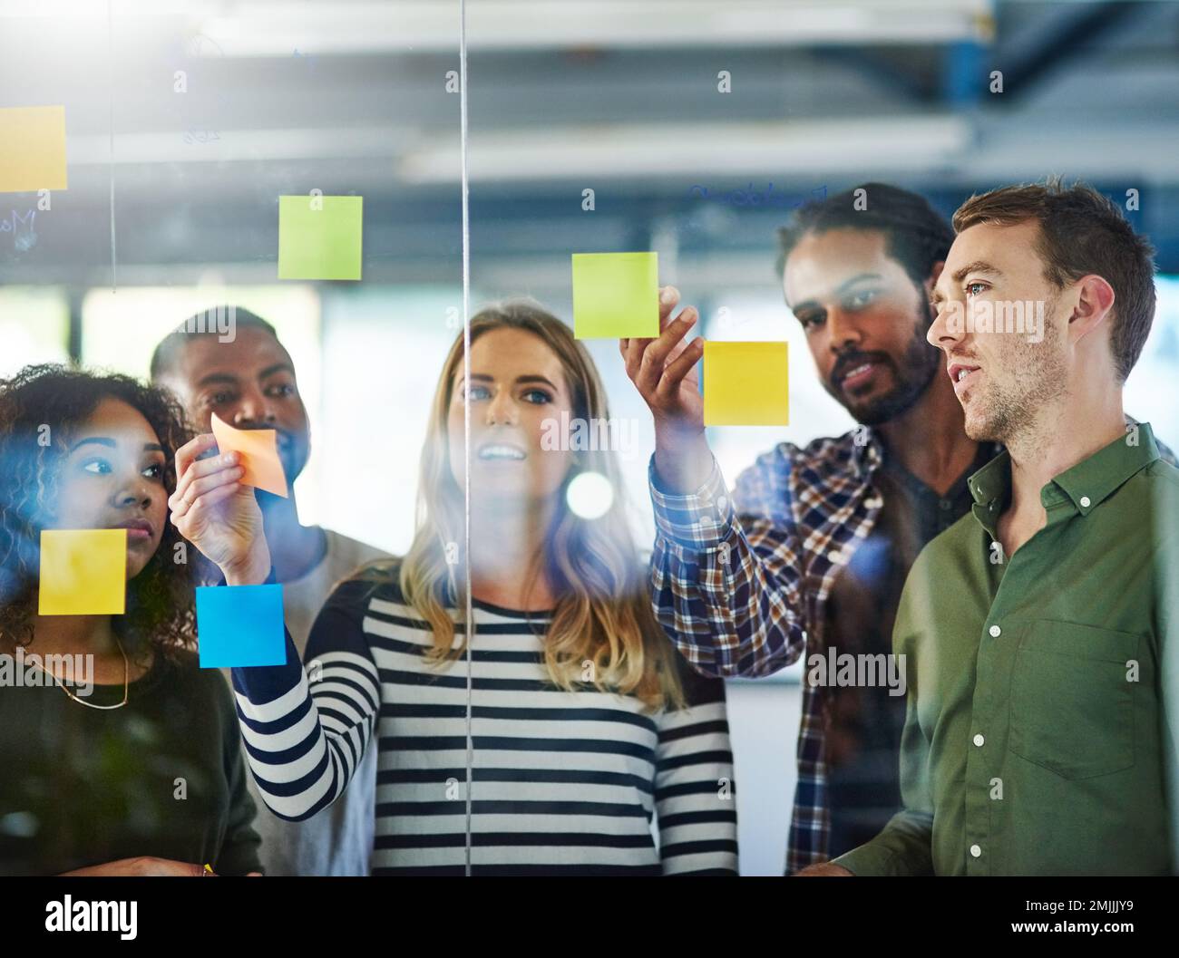 Working creatively as a unit. colleagues having a brainstorming session ...