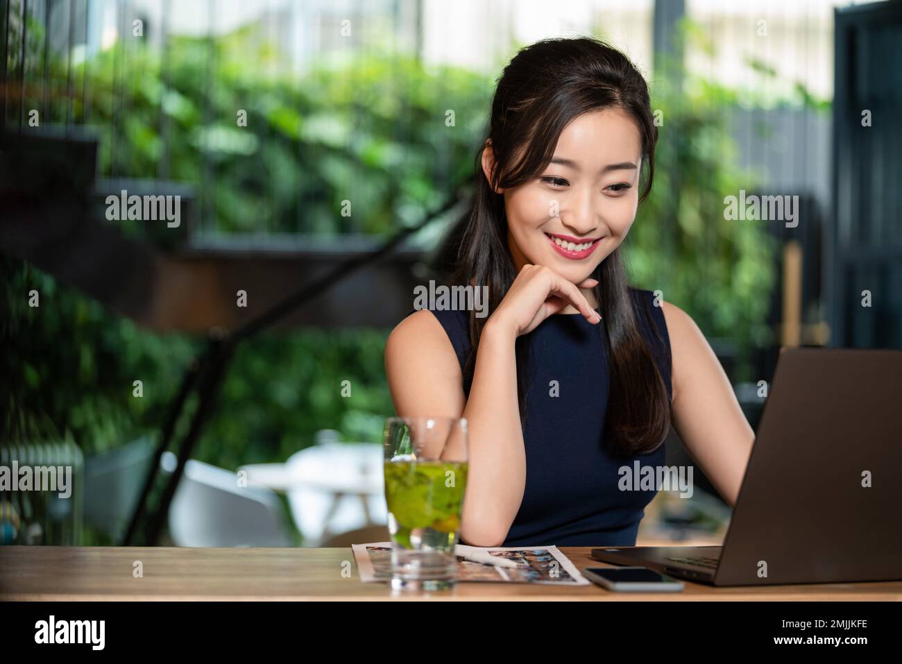 A young woman use the computer Stock Photo - Alamy