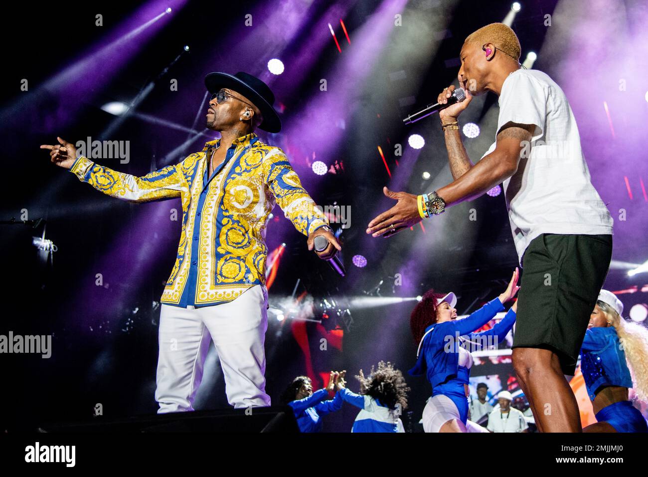 Teddy Riley, left, and Pharrell Williams perform at the 2019 Essence ...