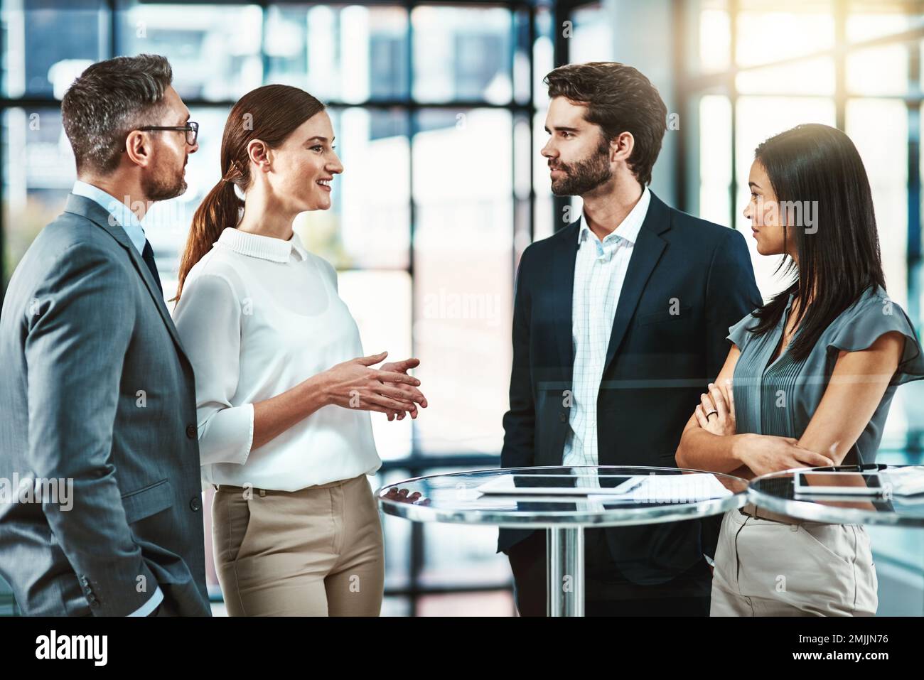 Quick update guys...a group of colleagues having a discussion in a ...