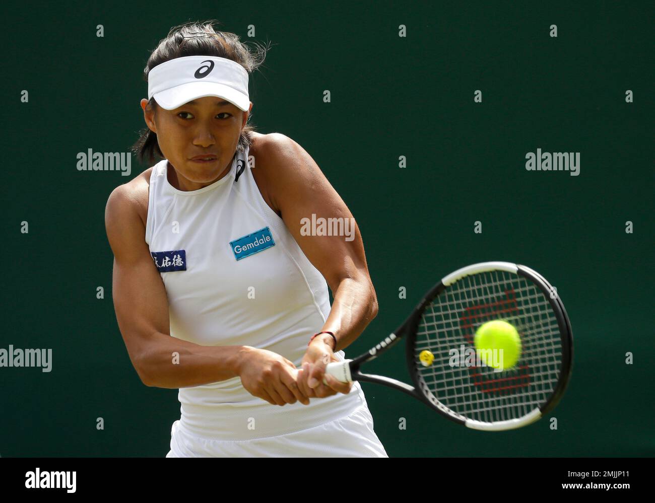 China's Shuai Zhang returns the ball to Ukraine's Dayana Yastremska in ...