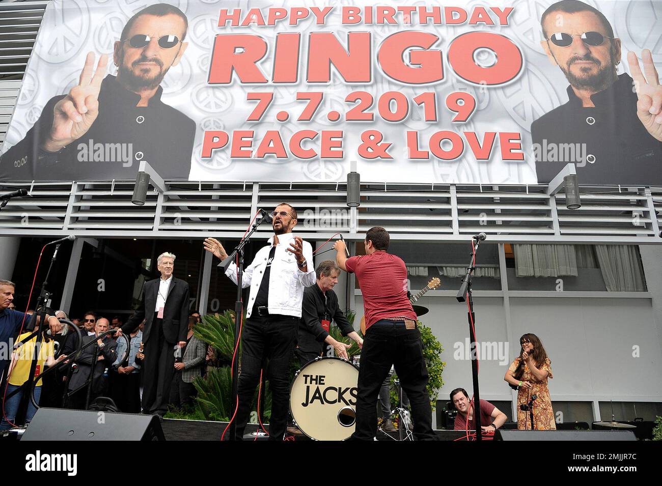 Ringo Star, center, and David Lynch, left, appear on stage during Ringo ...