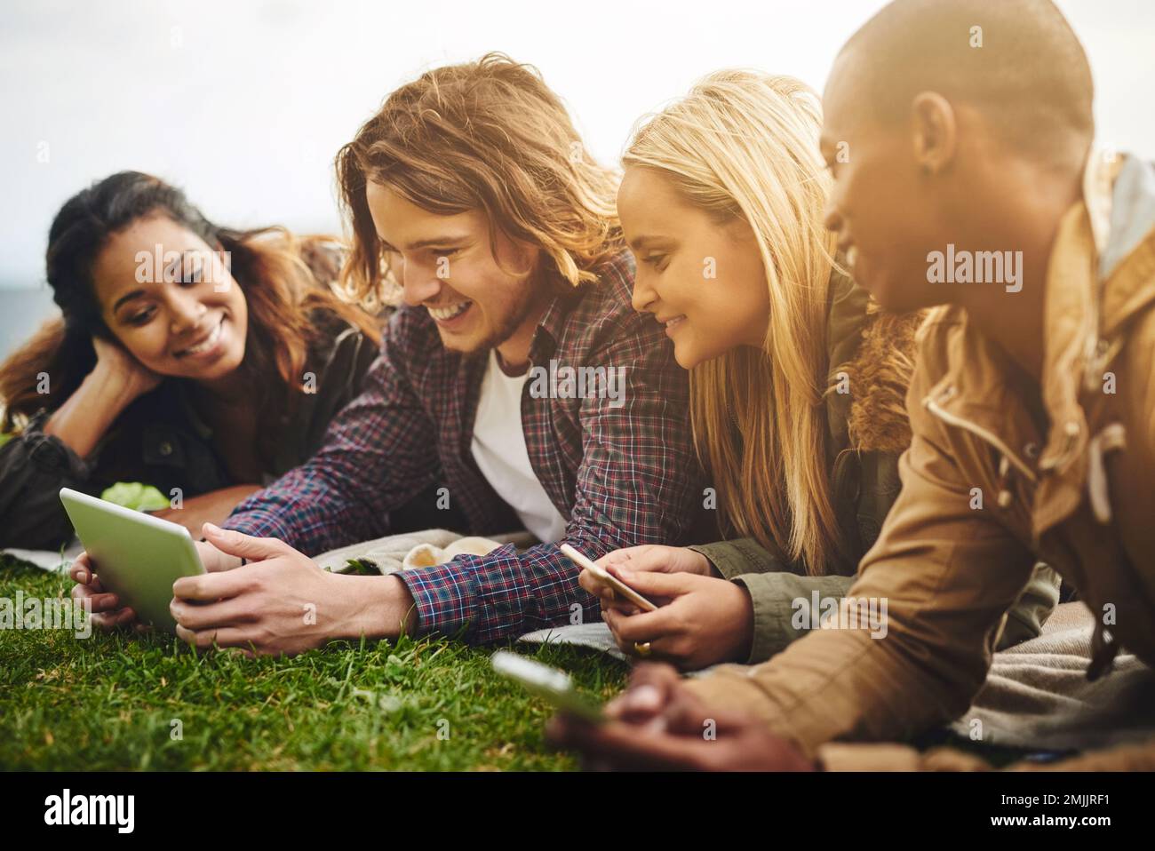 Entertainment on the go. a group of young friends having fun at a ...