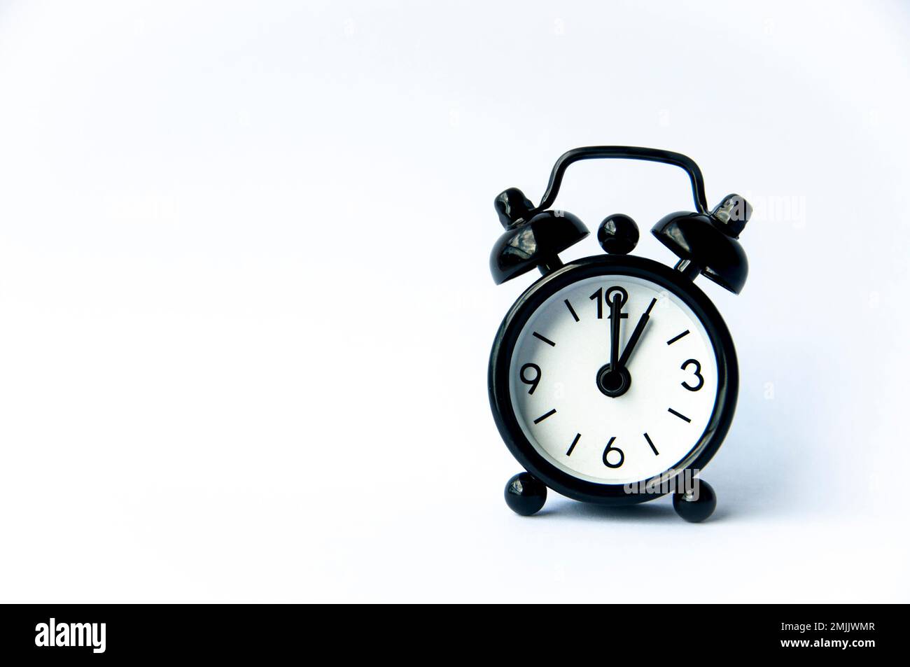 Black Alarm Clock Pointing At 1 O clock With Customizable Space For black-alarm-clock-pointing-at-1-o-clock-with-customizable-space-for