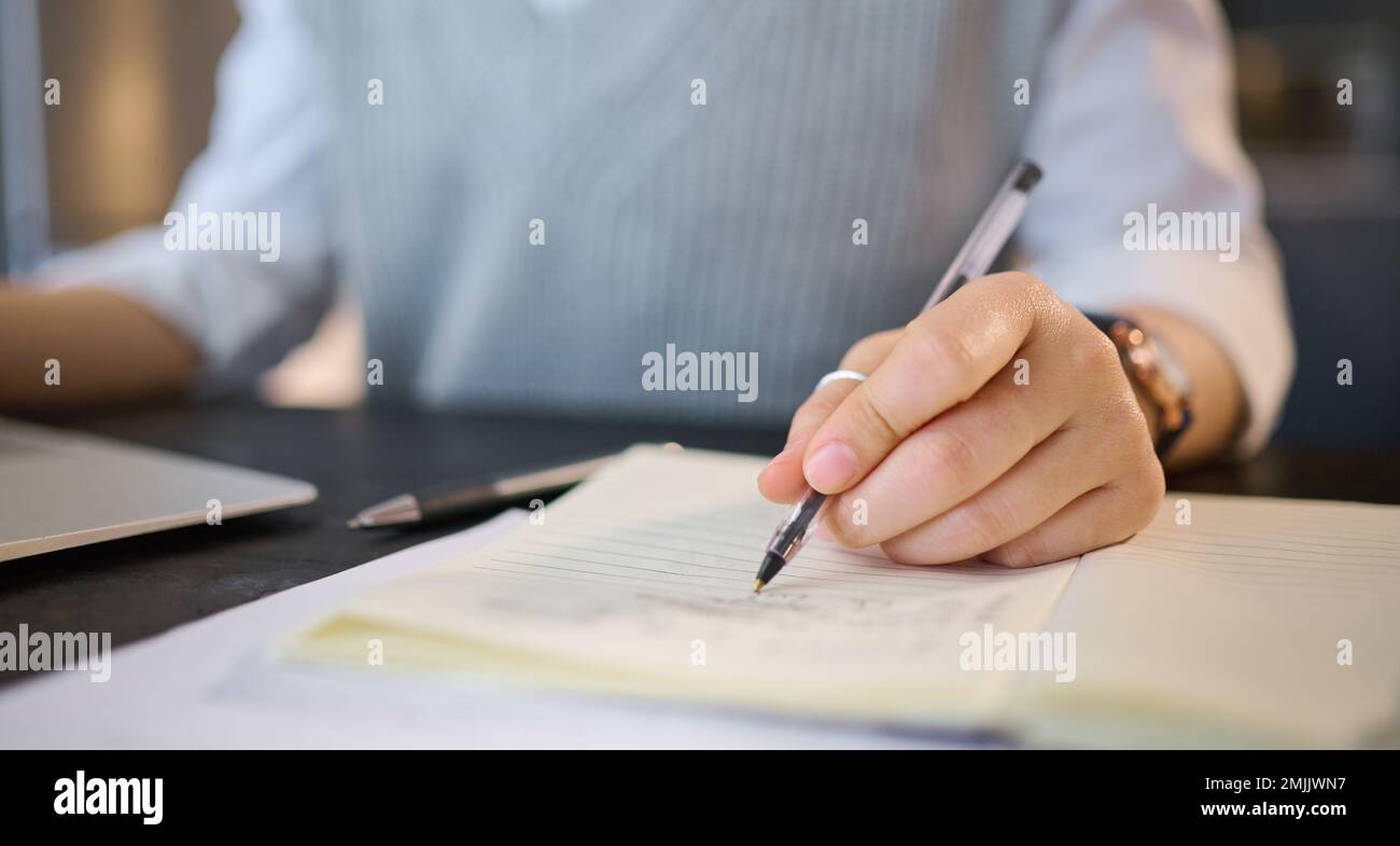 Hands, book and student writing notes with pen for studying and ...