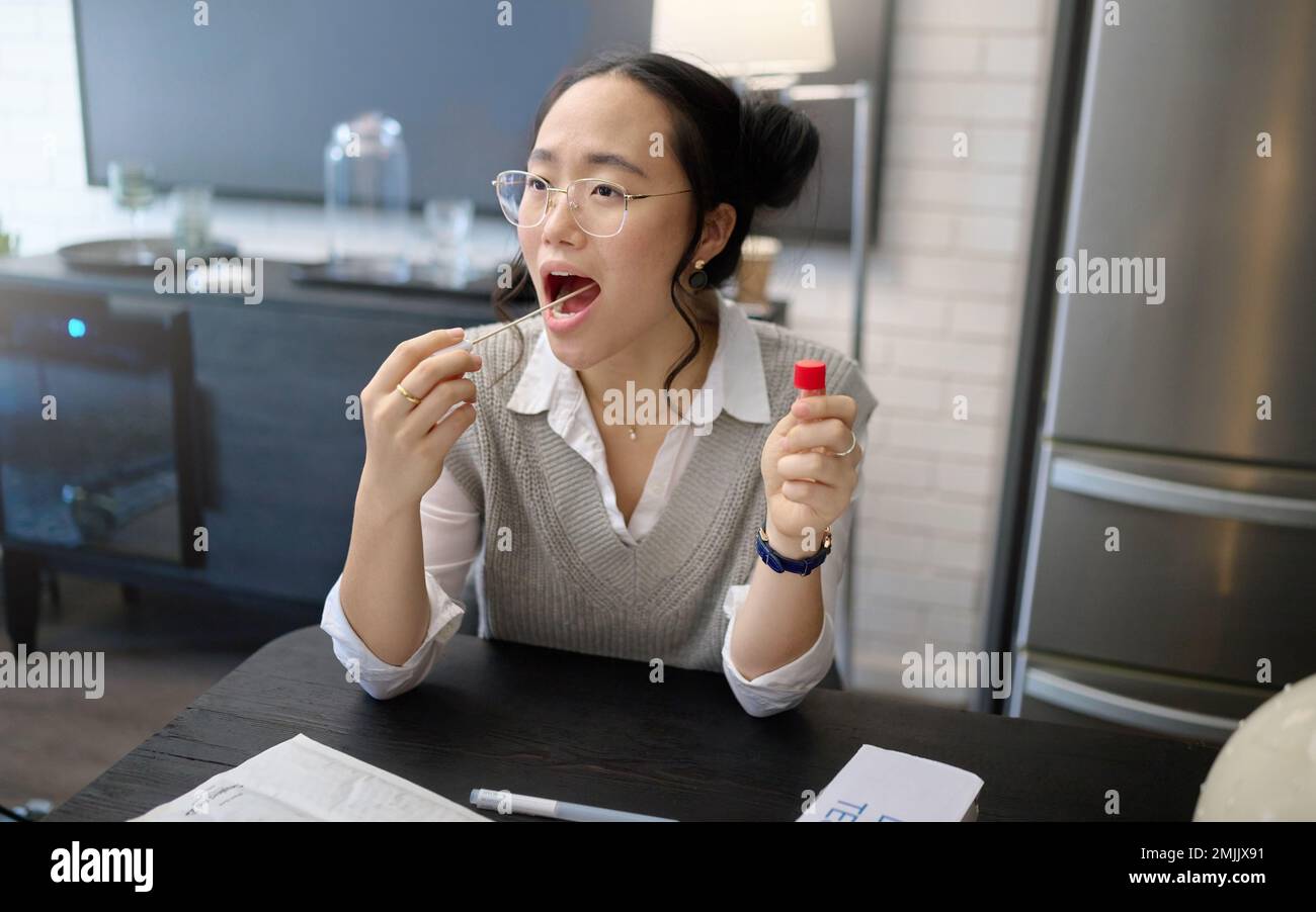 Covid test, mouth and pcr exam with Asian woman medical and healthcare ...