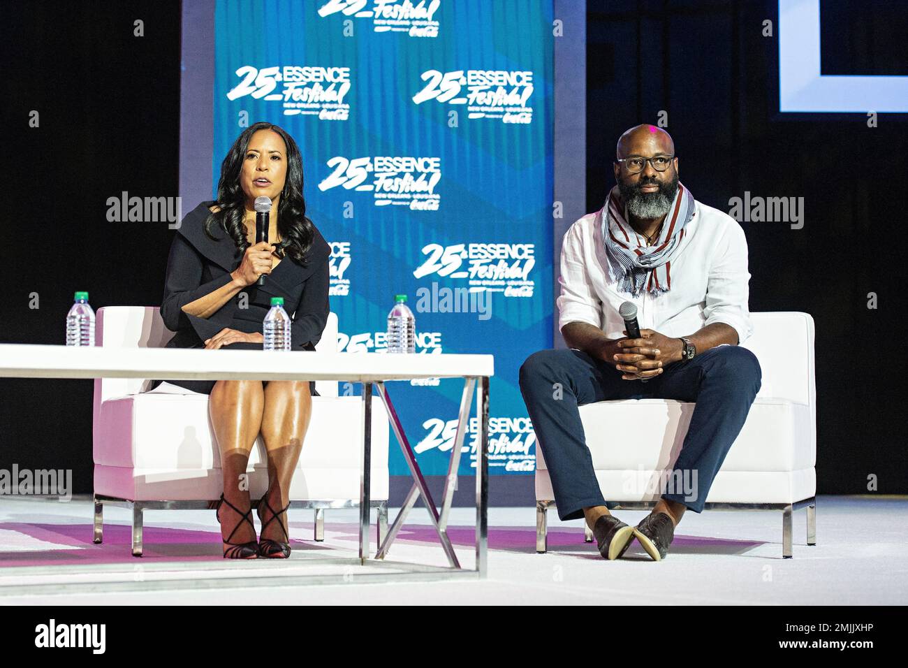 Michelle Ebanks, left, and Richelieu Dennis speak at the 2019 Essence ...