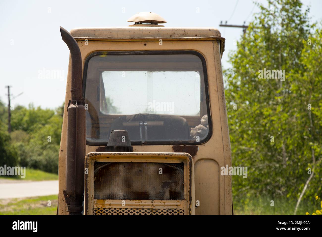 working tractor stands on a field in Ukraine to dig up land Stock Photo ...