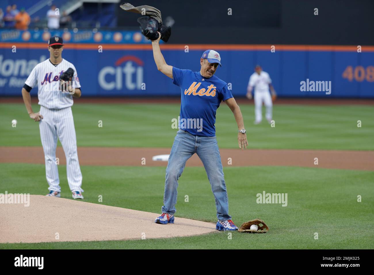 Comedian Jerry Seinfeld throws down his jacket before throwing out a ...