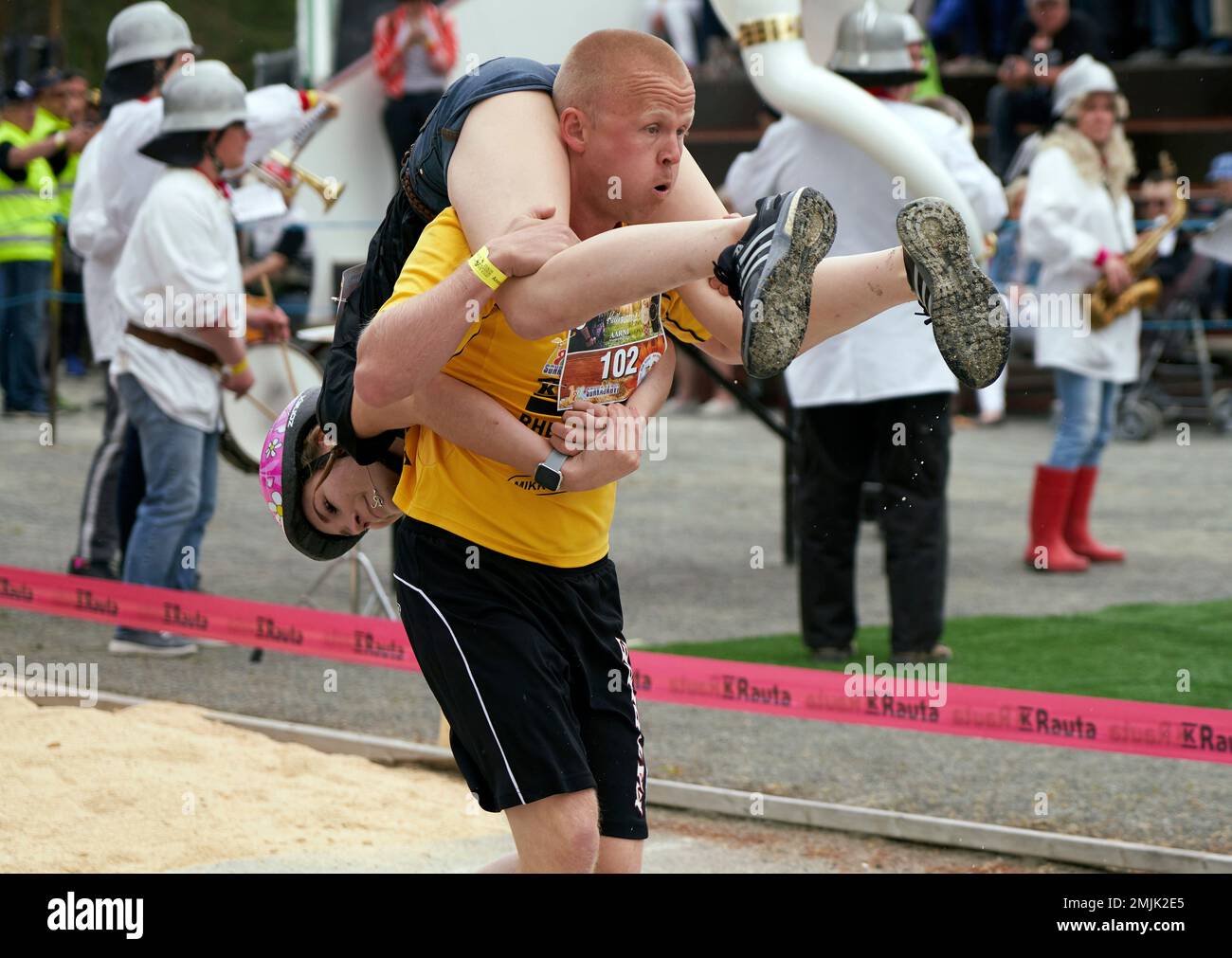 People take part in the wife carrying race, a 278-yard obstacle course ...