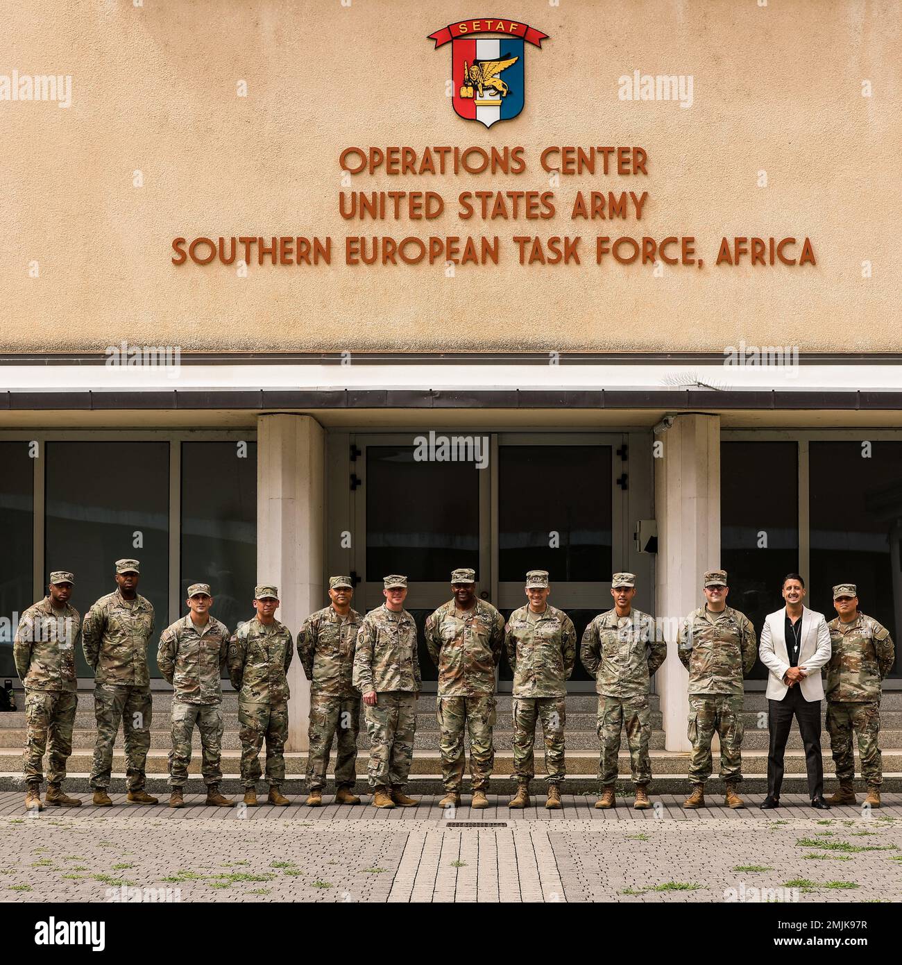 Members of the 207th Military Intelligence Brigade - Theater stand with ...