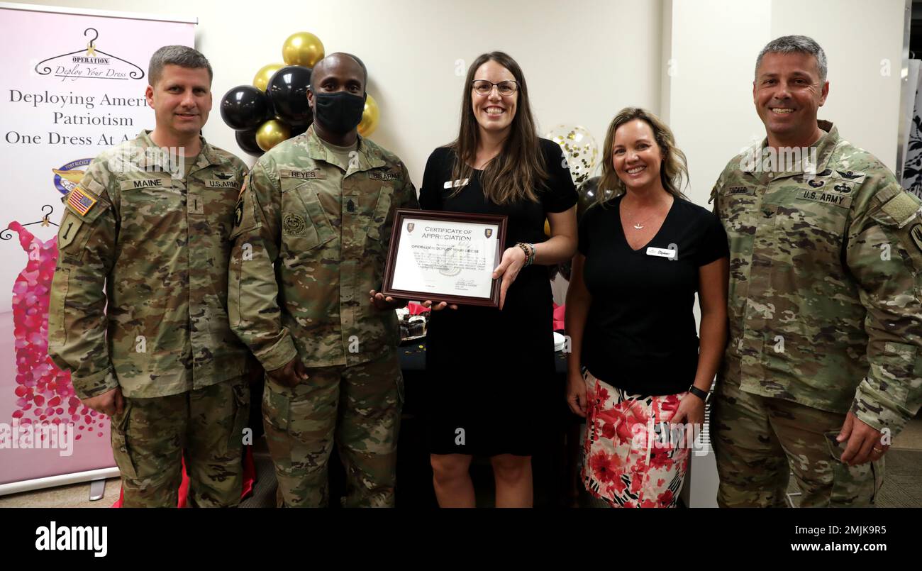Command Sgt. Maj. Terrence Reyes, Chief Warrant Officer 5 Michael Maine, and Col. Richard Tucker ...