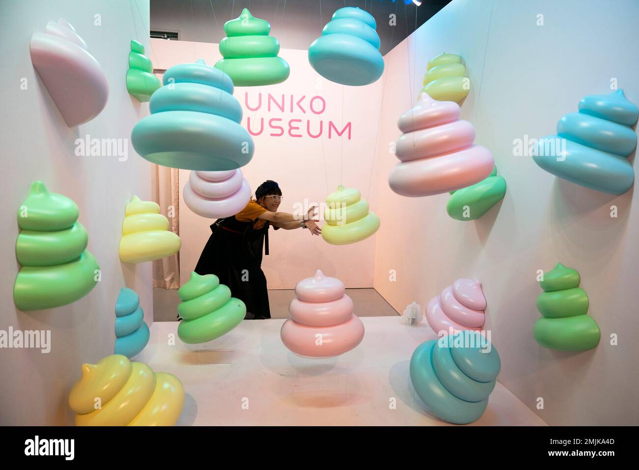 In this Tuesday, June 18, 2019, photo, a woman jokingly poses with ...