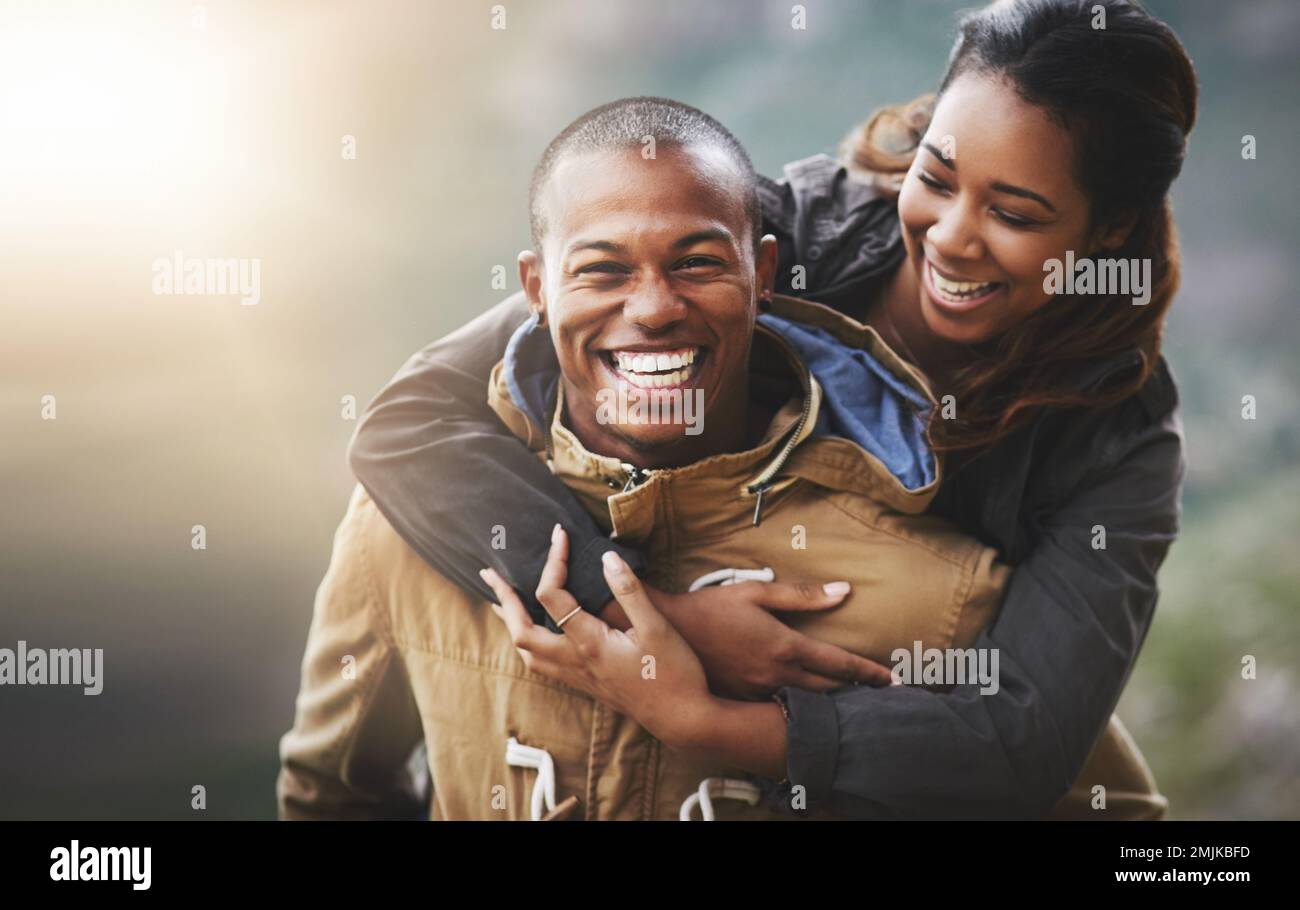Enjoying the thrill of young love. Portrait of a happy young couple ...