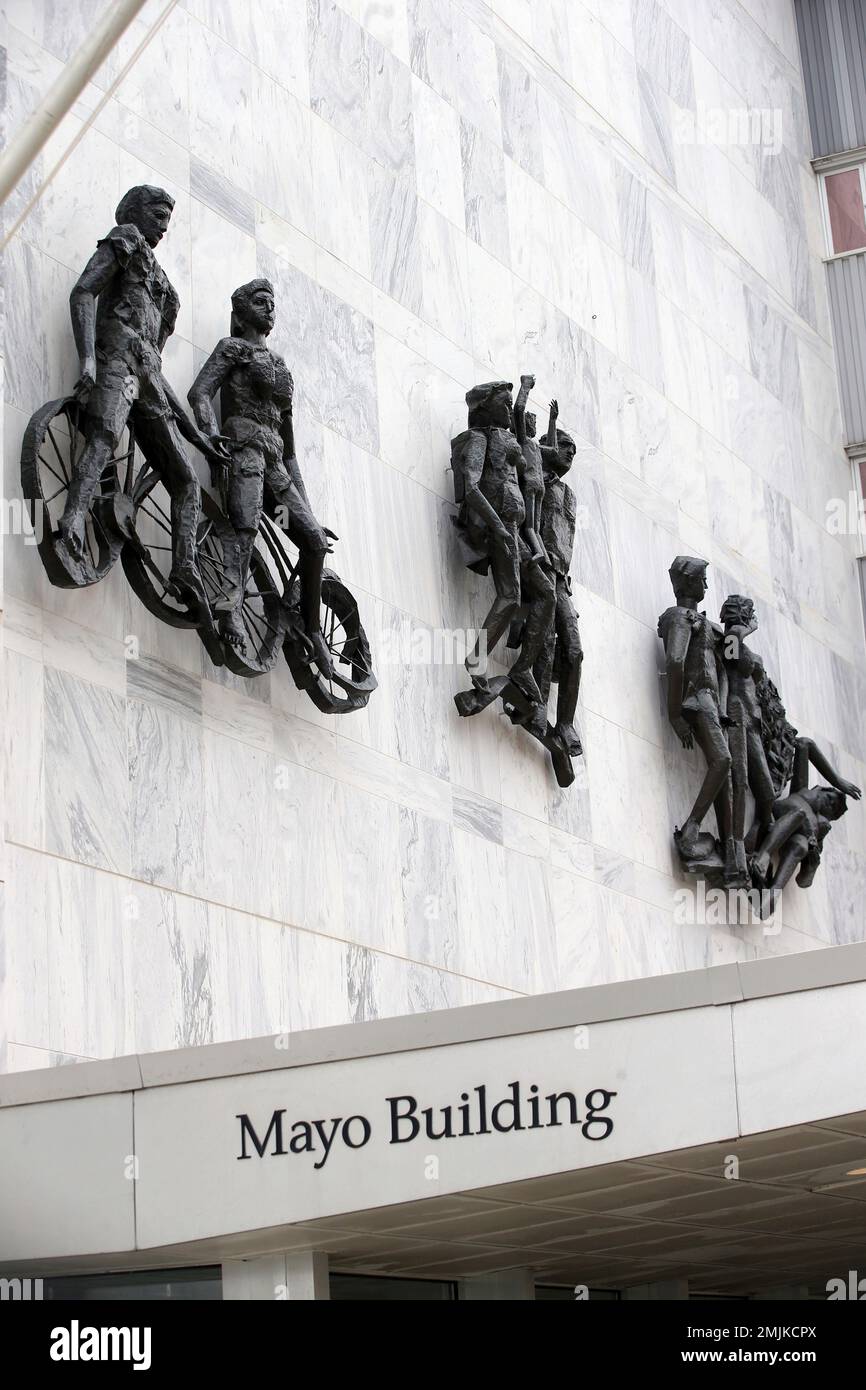 Sculptures hang on the side of the Mayo Building, part of the Mayo ...