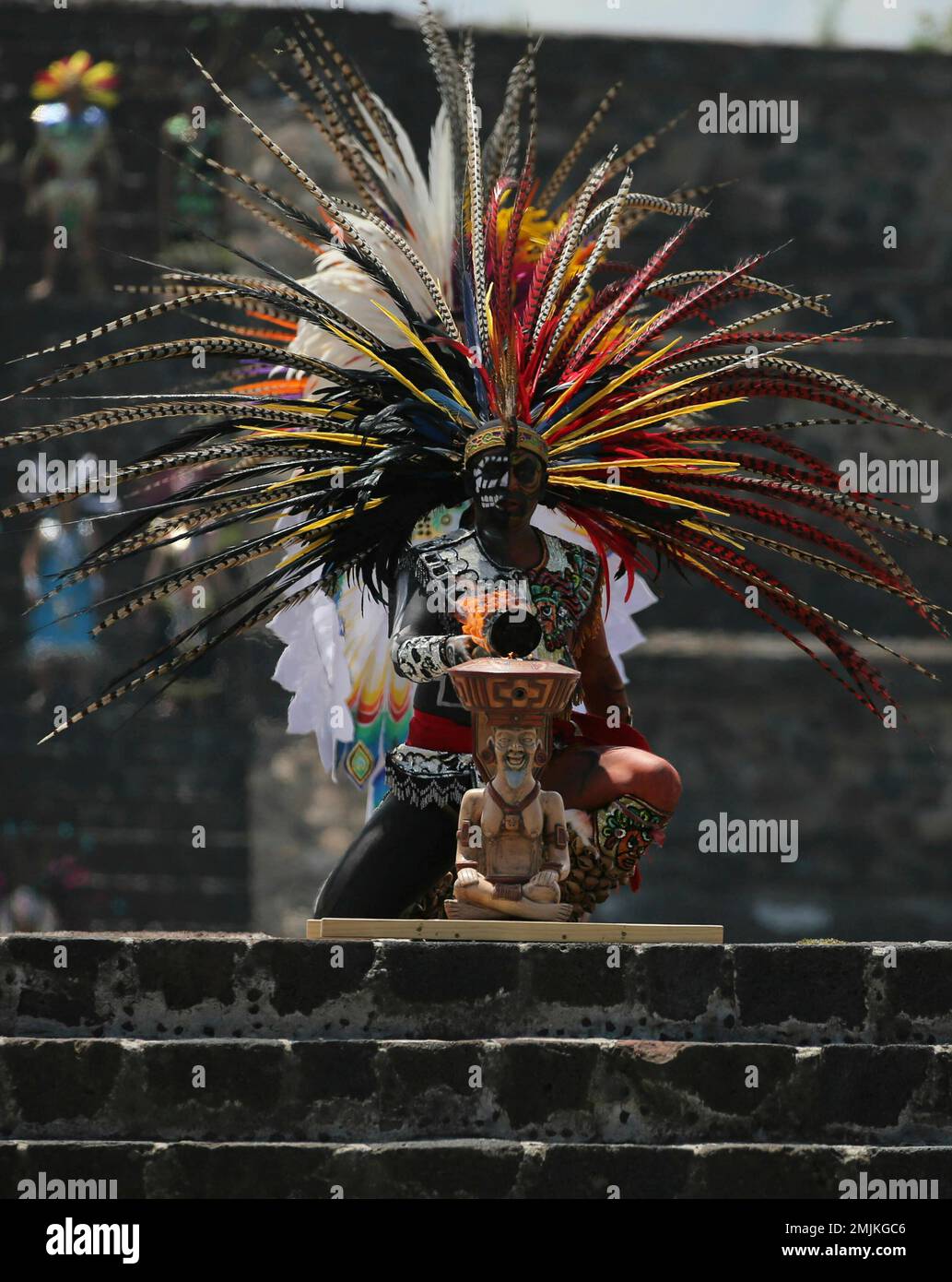 An Aztec dancer takes part in a lighting ceremony of the Pan Am flame ...