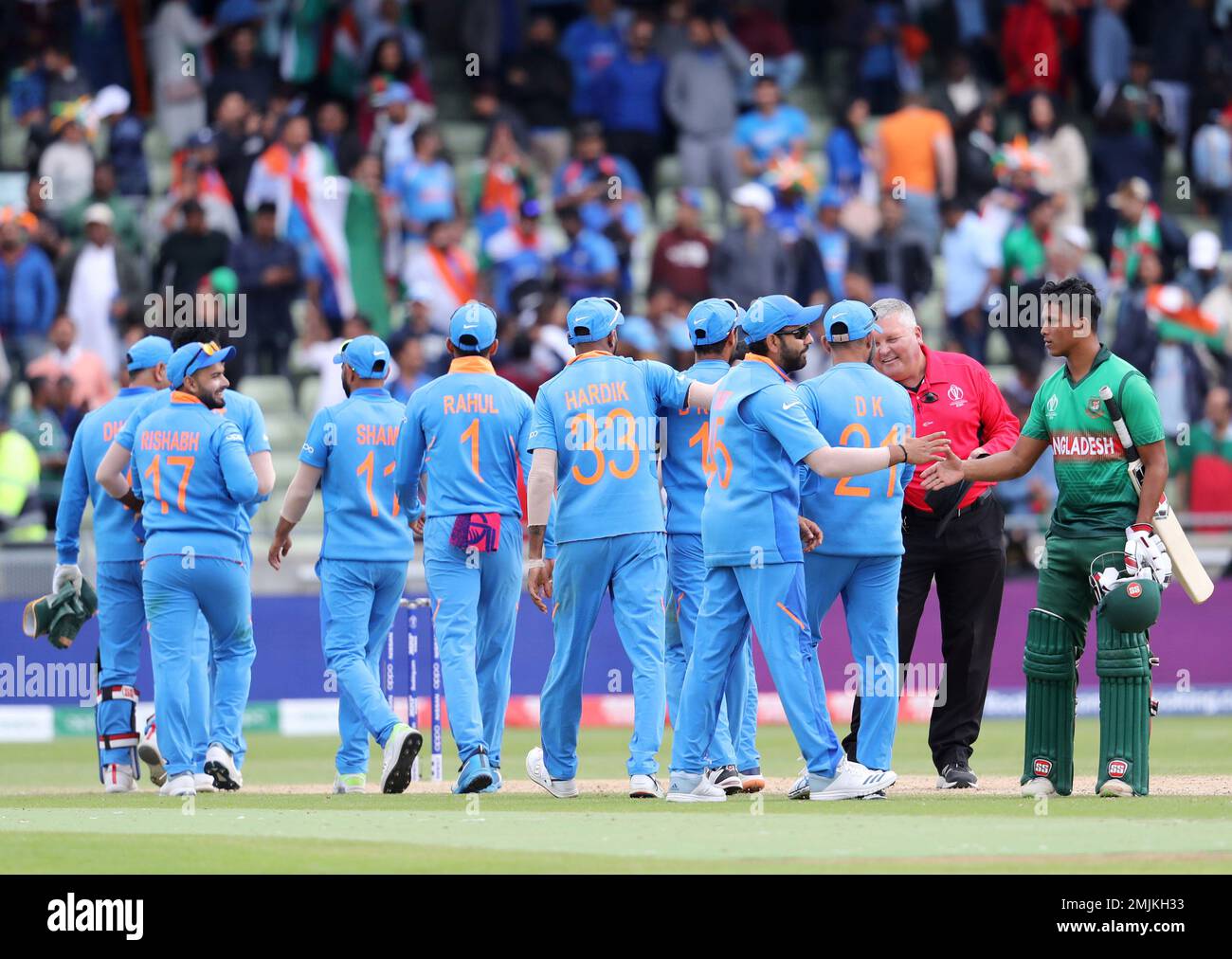Bangladesh's Mohammad Saifuddin shakes hands with Indian cricketers at ...