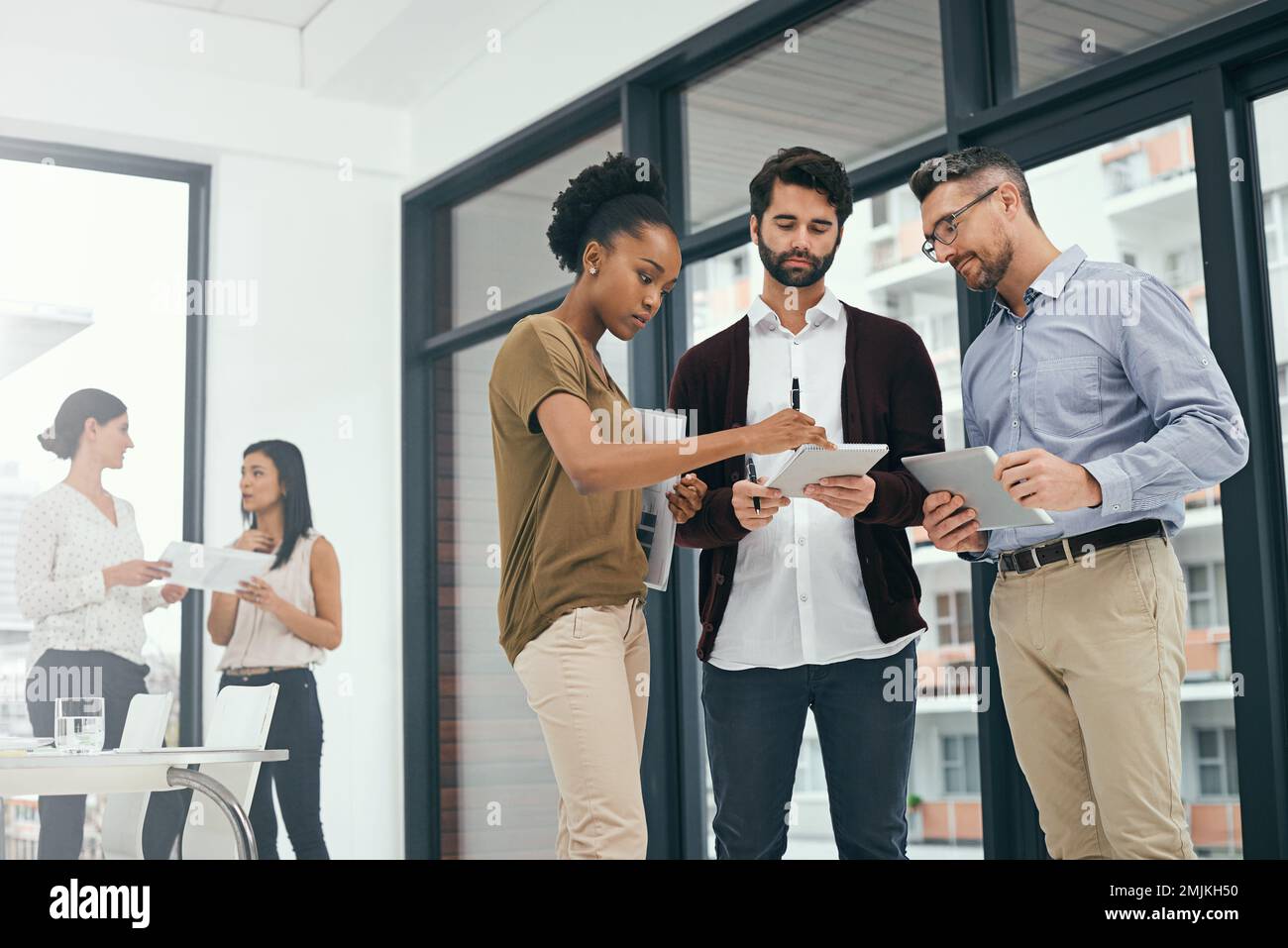 Problem solving together. a group of colleagues having a discussion in ...