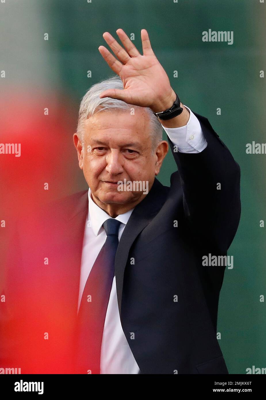 Mexico's President Andres Manuel Lopez Obrador waves to the crowd at ...