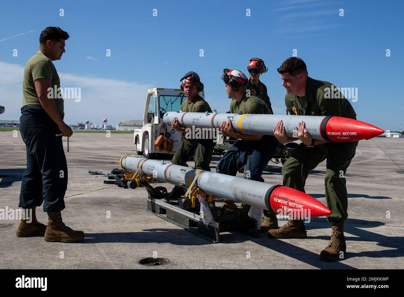 U.S. Marines with Marine Attack Squadron (VMA) 223 prepare to load an ...