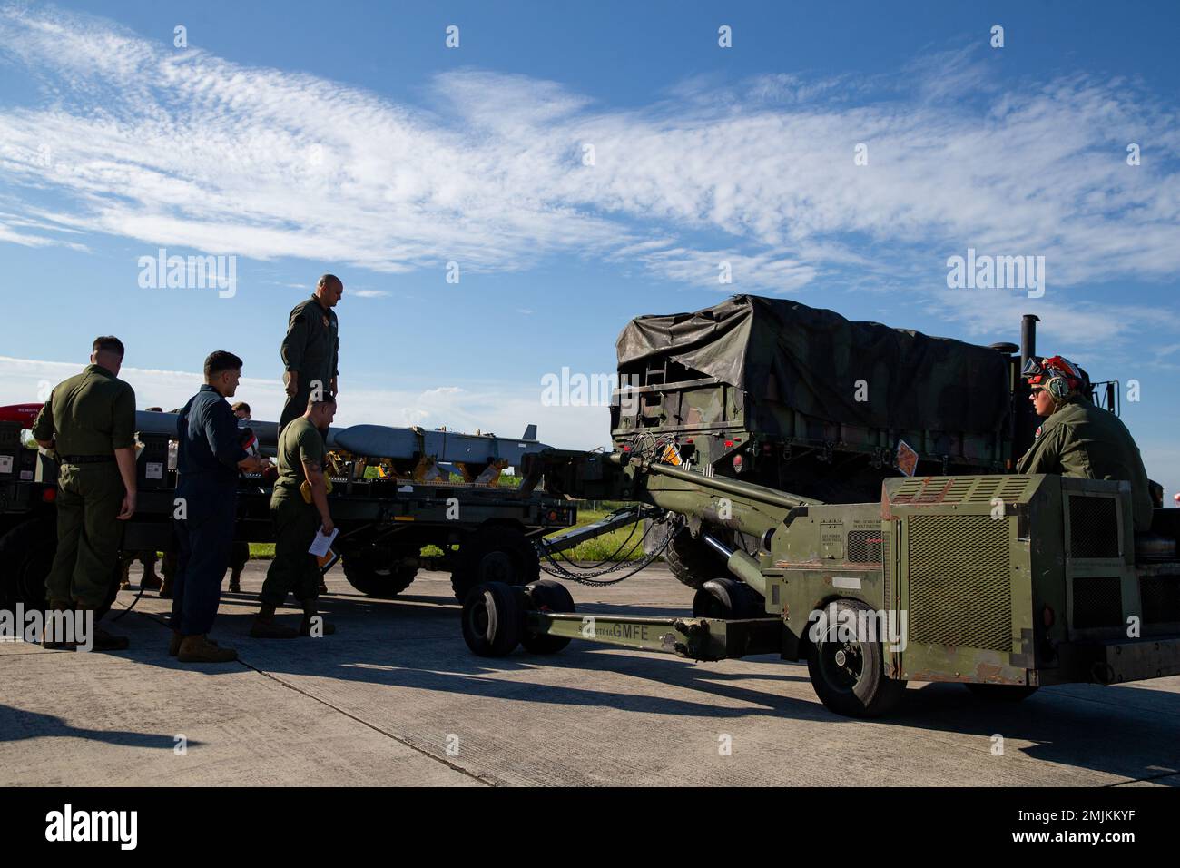 U.S. Marines with Marine Attack Squadron (VMA) 223 transport ordnance ...