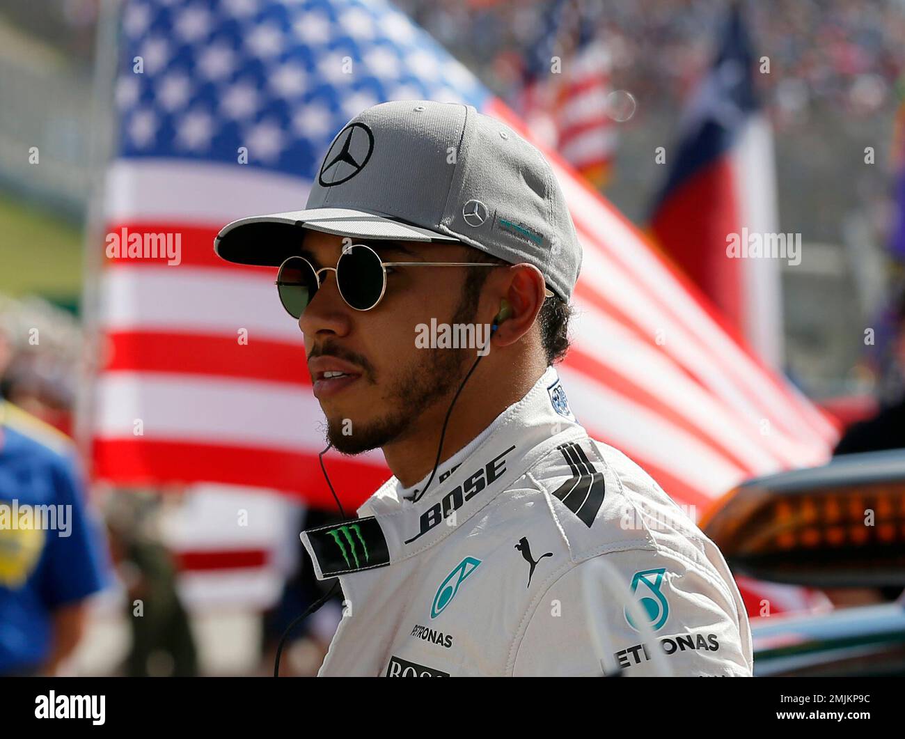 Mercedes driver Lewis Hamilton of Britain stands on the grid before ...