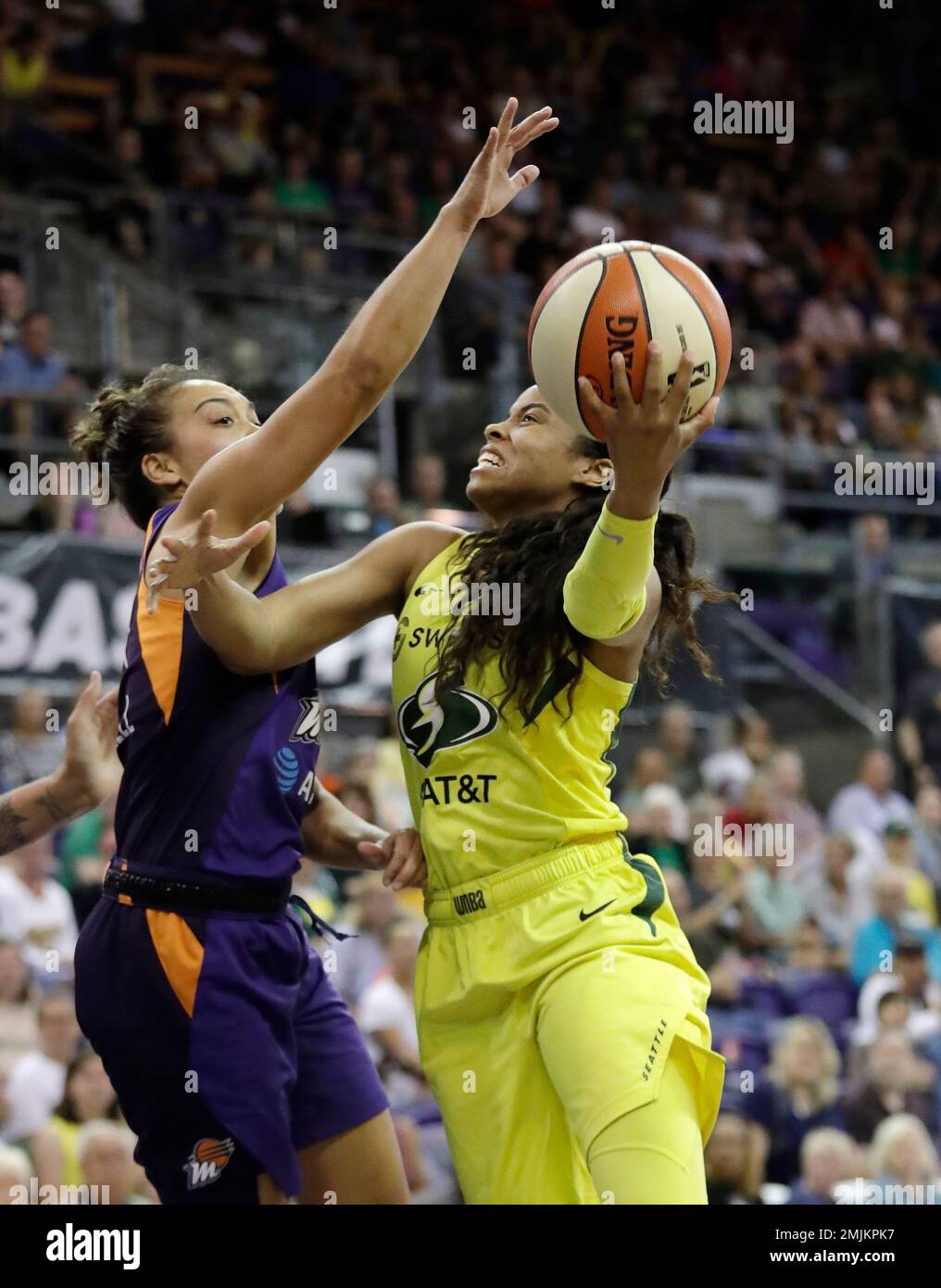 Seattle Storm's Jordin Canada, right, shoots as Phoenix Mercury's ...