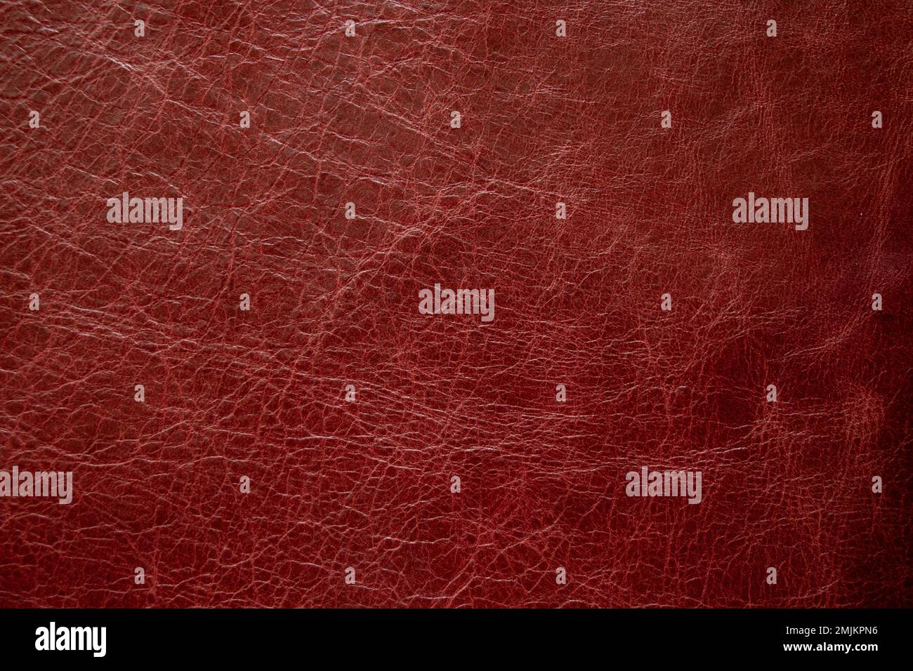 dark red genuine leather as a close up background Stock Photo - Alamy