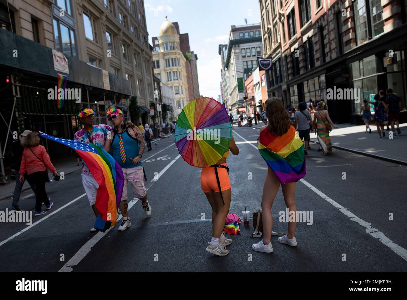 Parade-goers gather during the LBGTQ Pride march on Sunday, June 30 ...