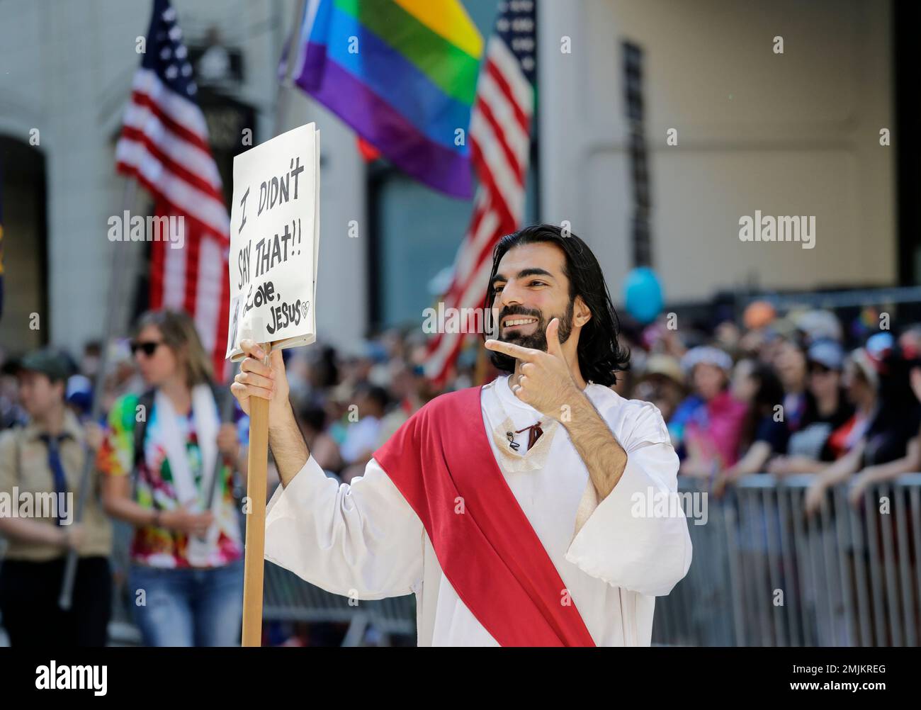A man dressed as Jesus marches during the 45th annual Seattle Pride ...