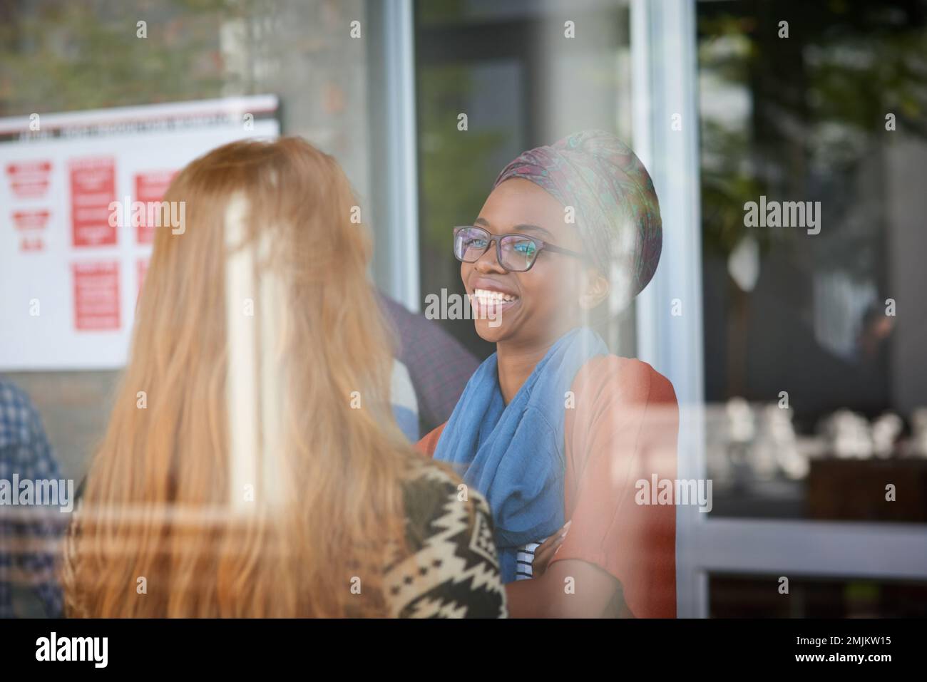 Catching up between their breaks. two university students socialising ...