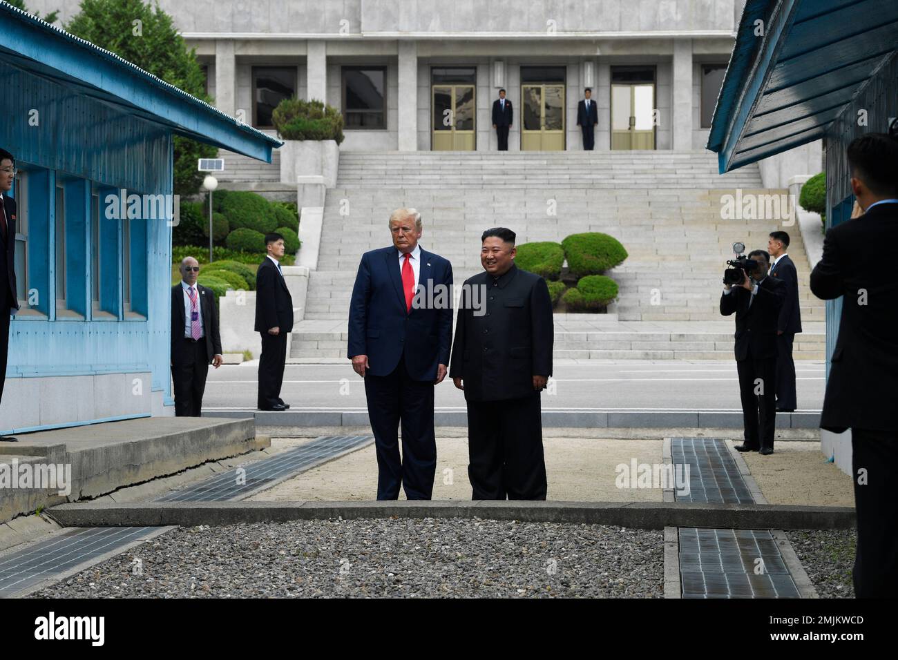 President Donald Trump and North Korean leader Kim Jong Un stand on the ...