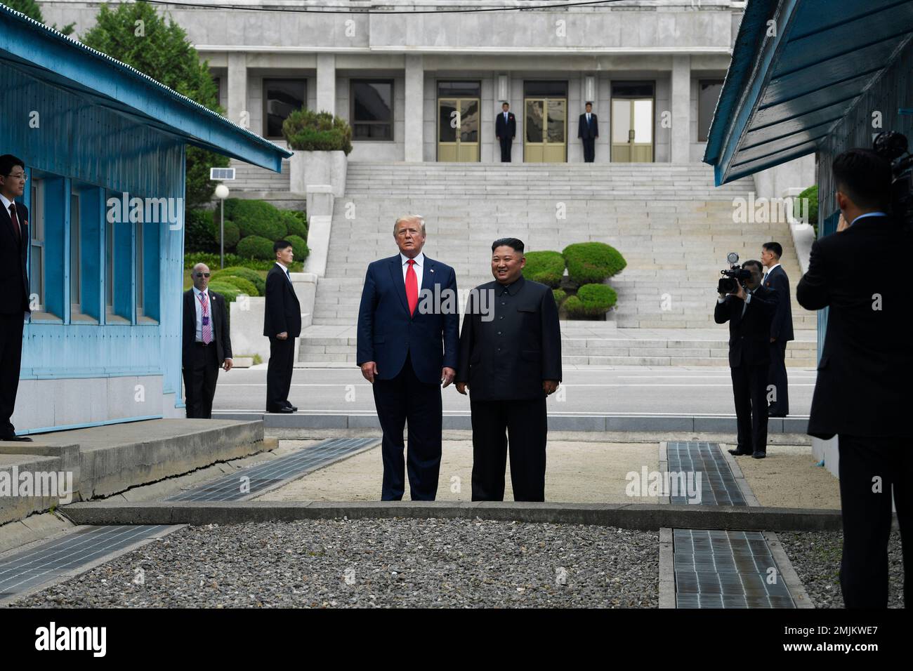 President Donald Trump and North Korean leader Kim Jong Un stand on the ...