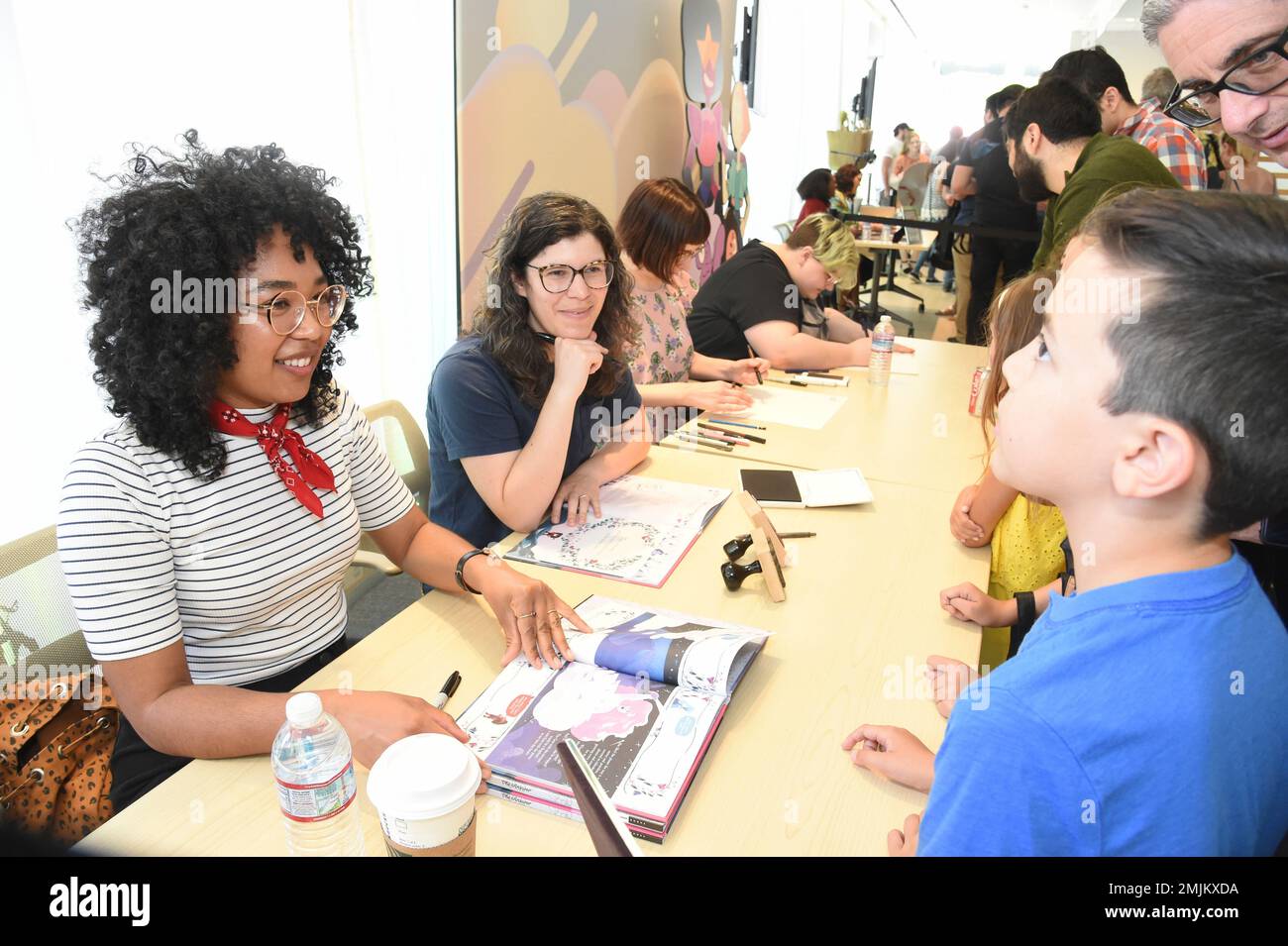 Tiffany Ford and Rebecca Sugar sign copies of "The Answer" during It's ...