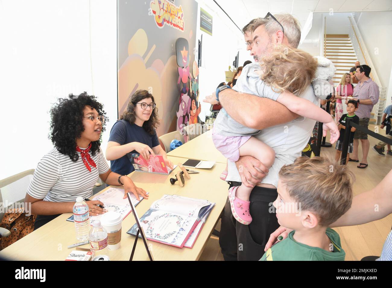 Tiffany Ford and Rebecca Sugar sign copies of "The Answer" during It's ...