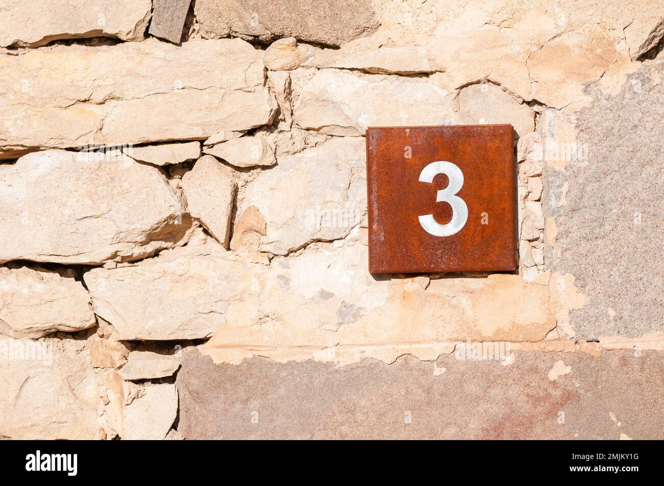 a house number plaque, number 3, Weathering steel Stock Photo - Alamy