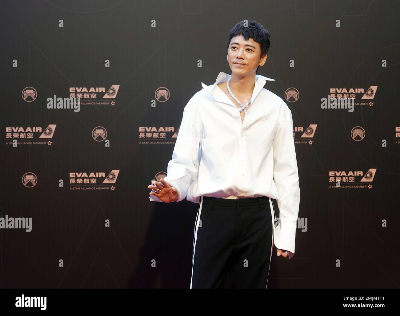 Taiwanese singer Shin smiles as he arrives at the 30th Golden Melody ...