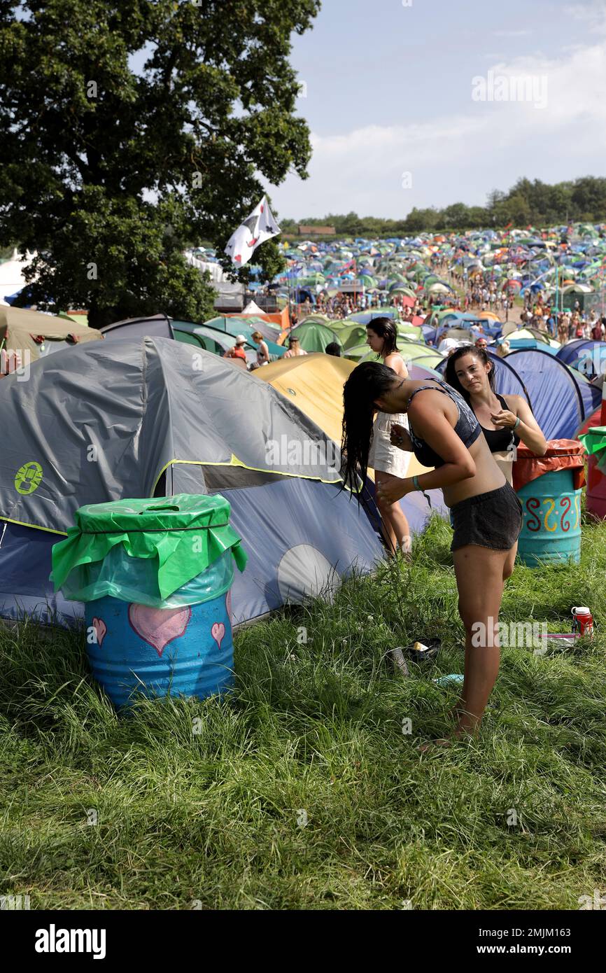 Revellers improvise and wash their hair in the open, on the fourth day ...