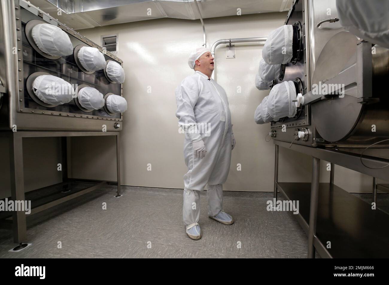 Ryan Zeigler, Apollo sample curator, stands between the nitrogen filled ...
